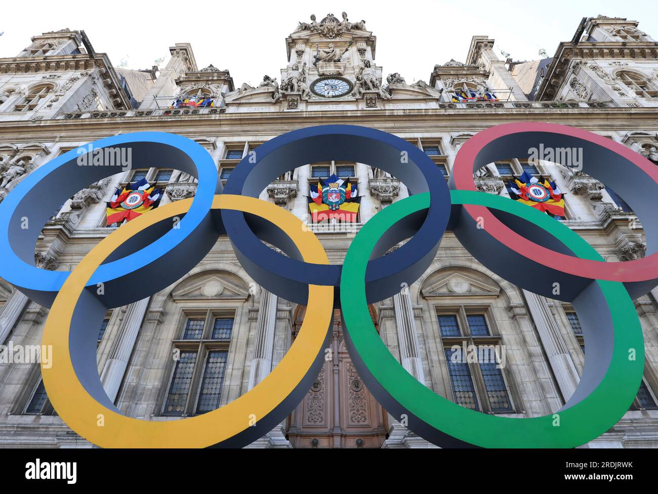 A photo shows the five-ringed Olympic symbol in front of Paris City ...