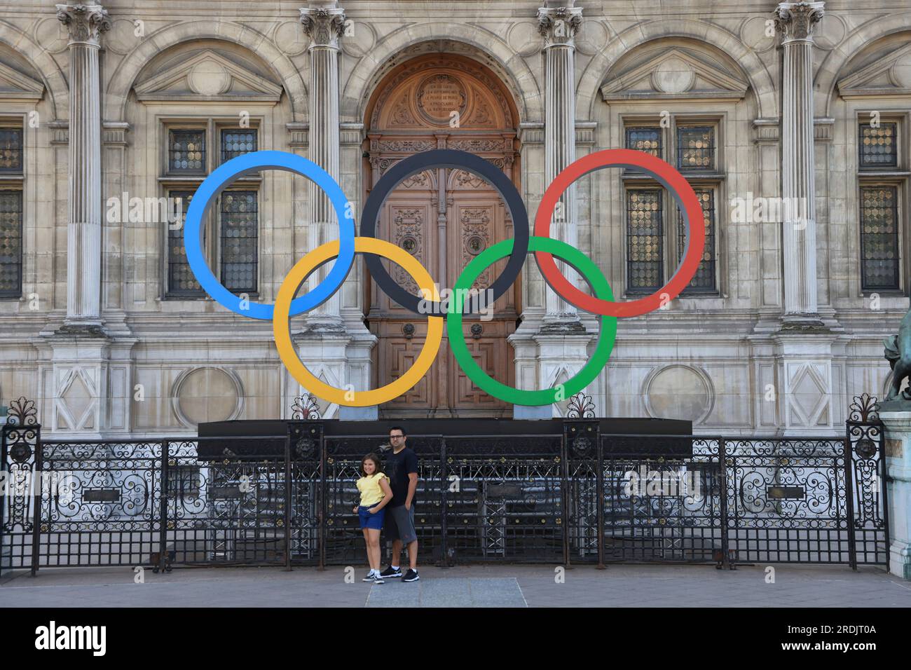 A photo shows the five-ringed Olympic symbol in front of Paris City ...