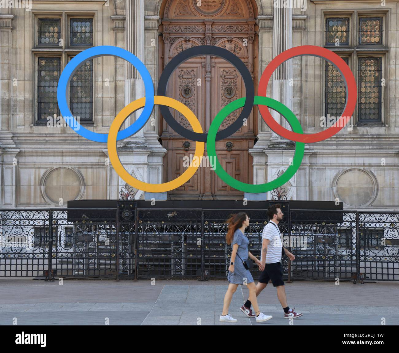 A photo shows the five-ringed Olympic symbol in front of Paris City ...