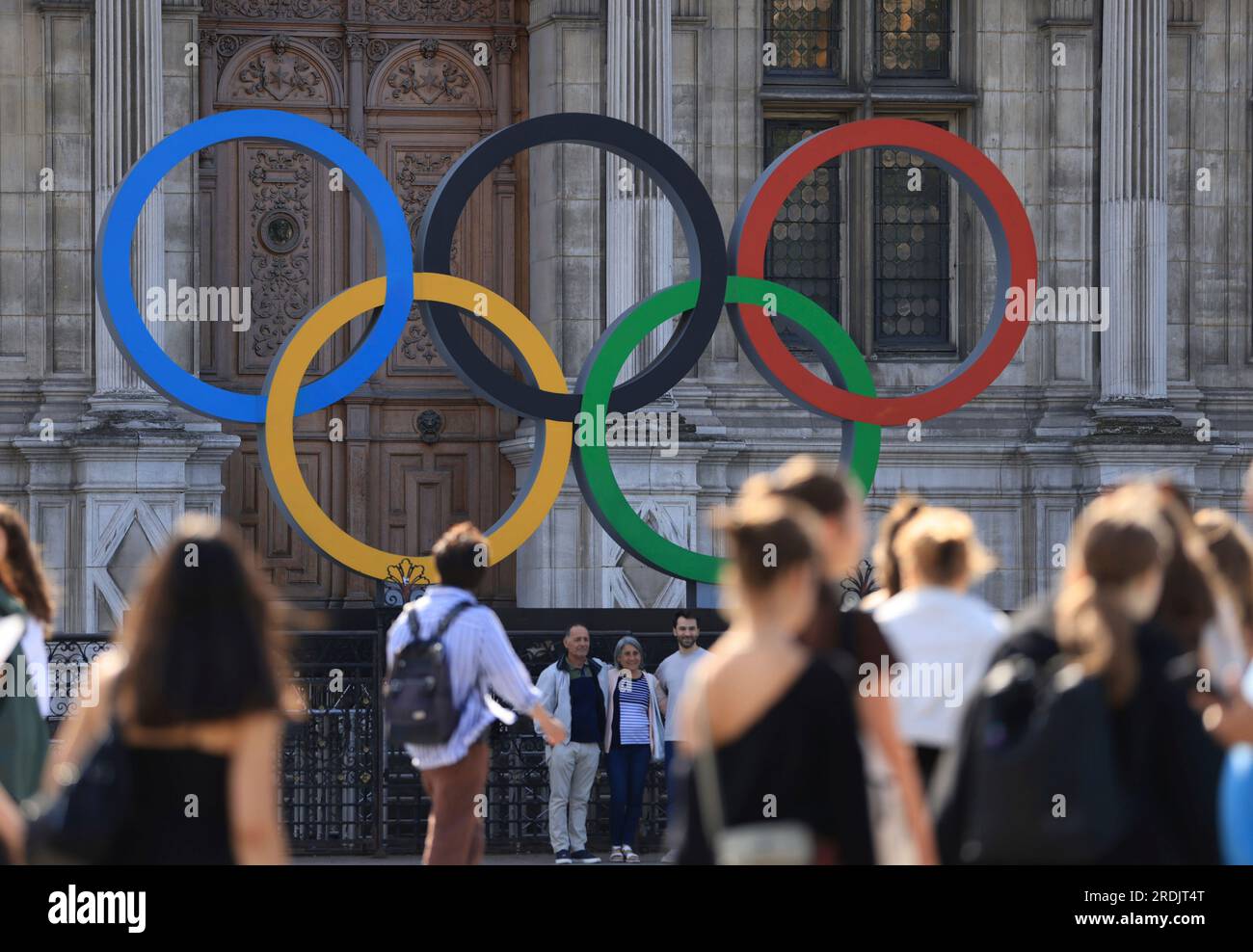 A photo shows the five-ringed Olympic symbol in front of Paris City ...