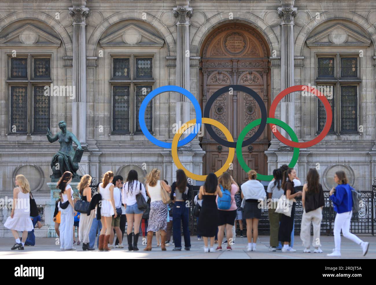 A photo shows the five-ringed Olympic symbol in front of Paris City ...