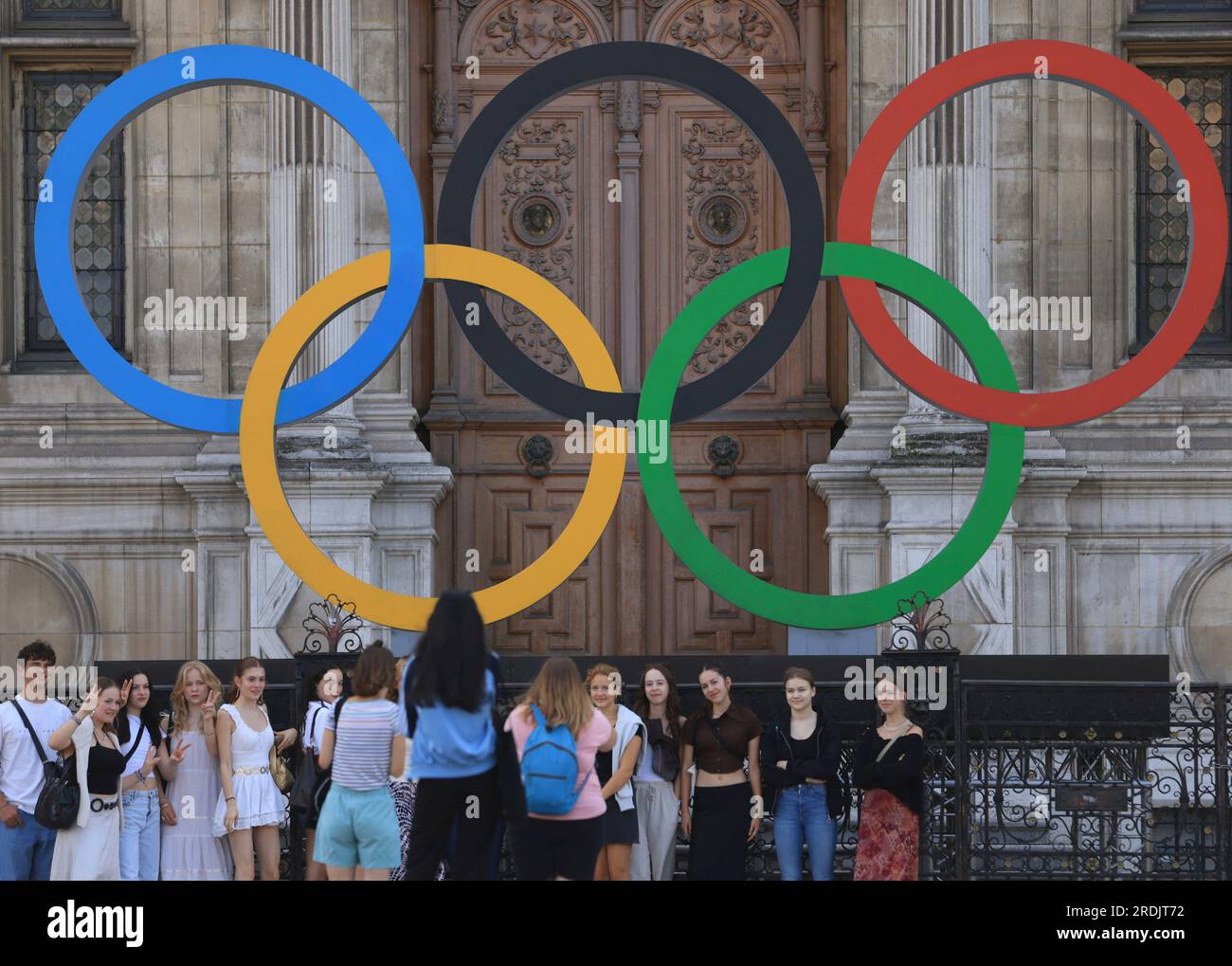 A photo shows the five-ringed Olympic symbol in front of Paris City ...