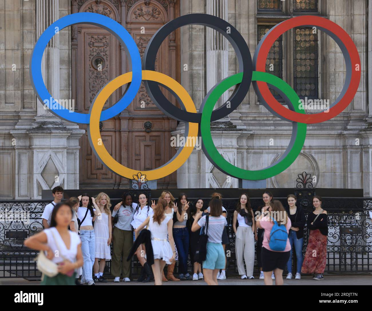 A photo shows the five-ringed Olympic symbol in front of Paris City ...