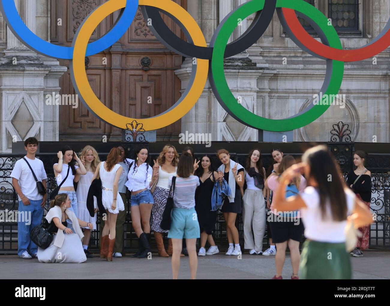 A photo shows the five-ringed Olympic symbol in front of Paris City ...