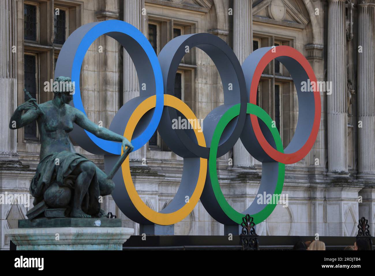 A photo shows the five-ringed Olympic symbol in front of Paris City ...