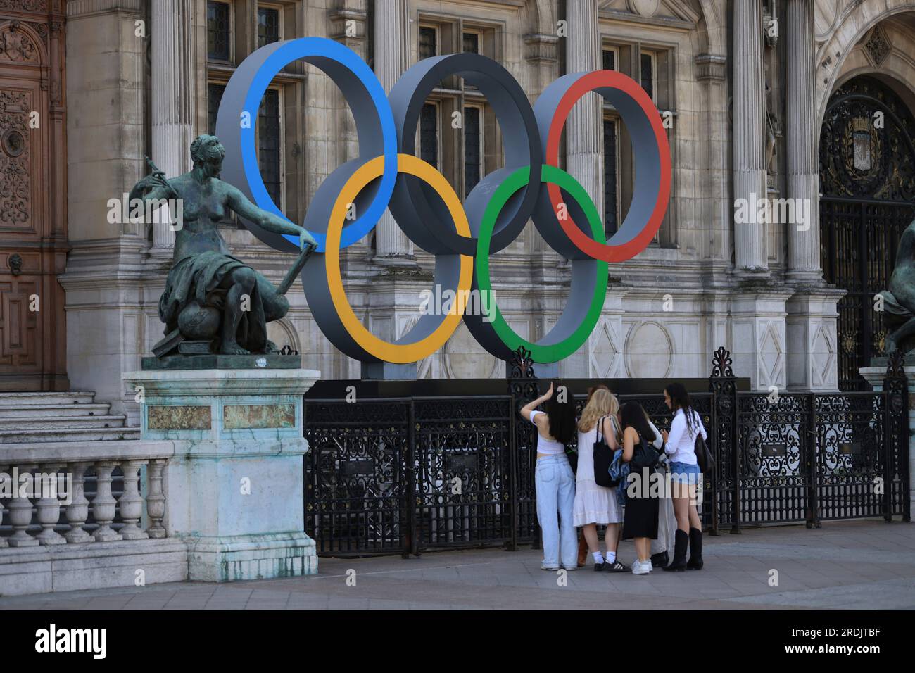 A photo shows the five-ringed Olympic symbol in front of Paris City ...