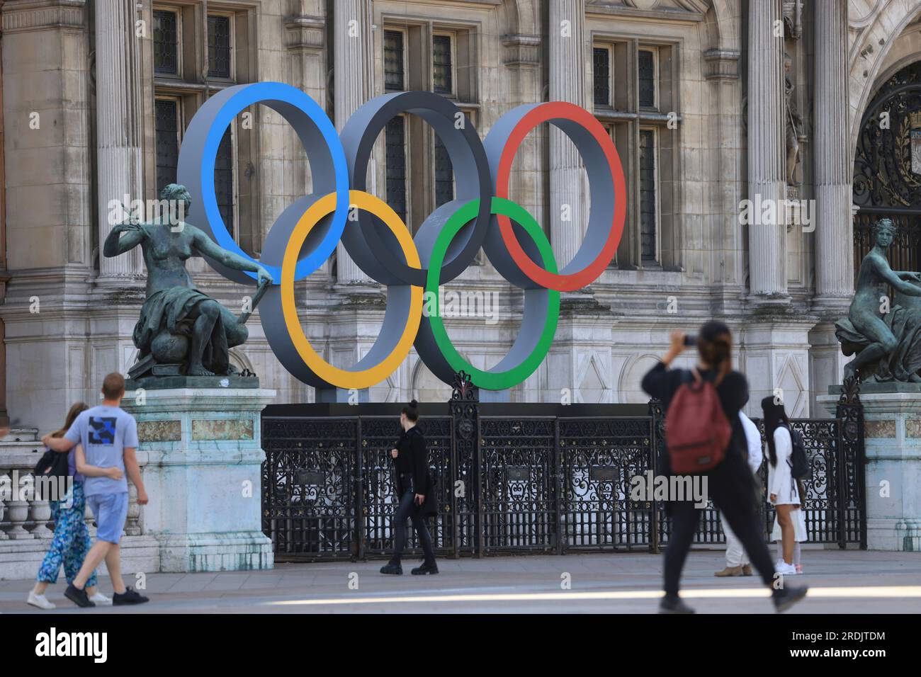 A photo shows the five-ringed Olympic symbol in front of Paris City ...