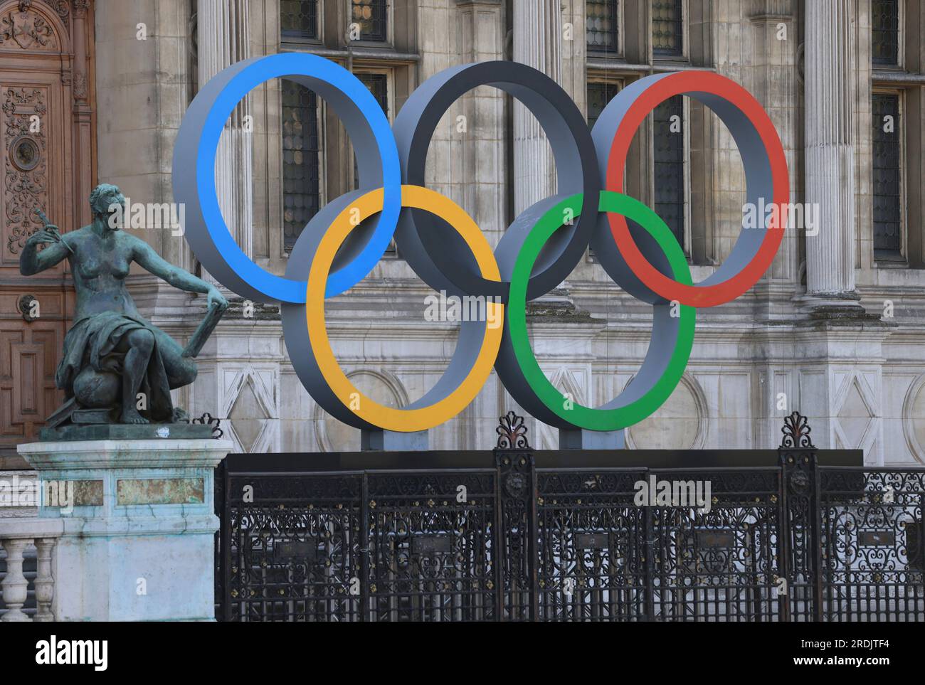 A photo shows the five-ringed Olympic symbol in front of Paris City ...