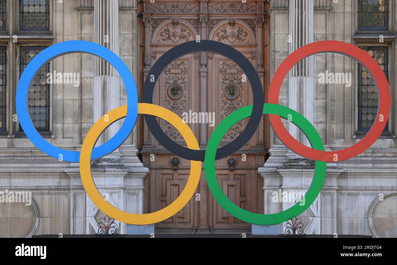 A photo shows the five-ringed Olympic symbol in front of Paris City ...