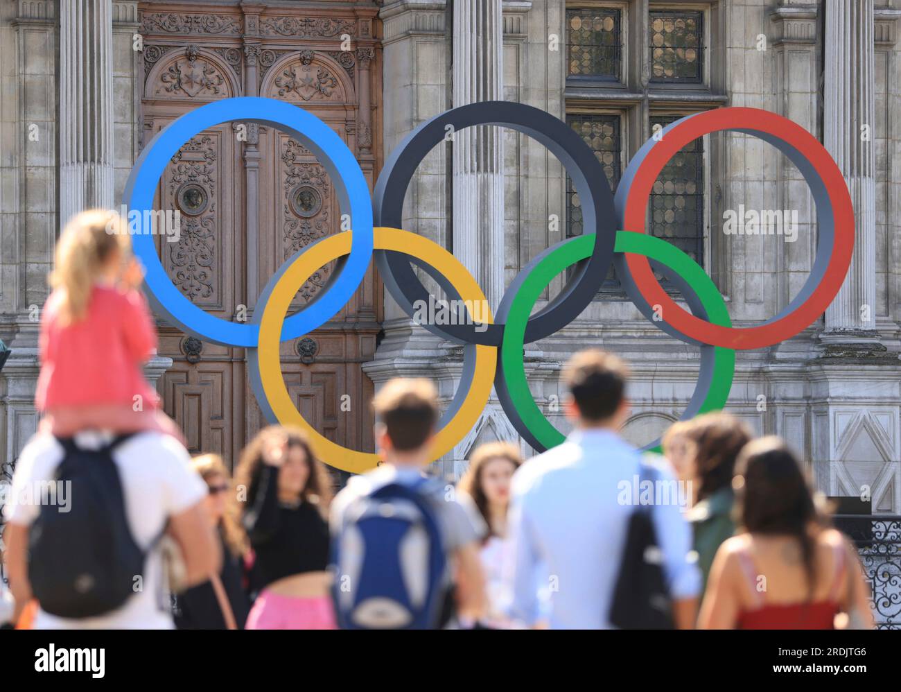 A photo shows the five-ringed Olympic symbol in front of Paris City ...