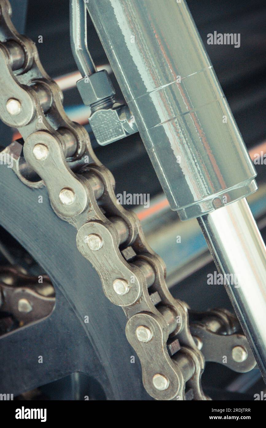 Metal chain and gear as detail and part of agricultural and industrial ...