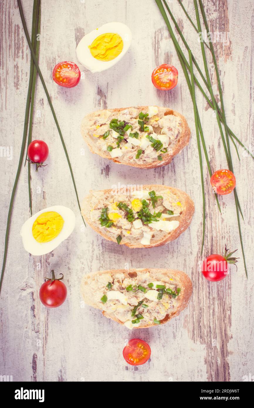 Vintage photo, Crusty baguette with prepared mackerel fish paste and ...