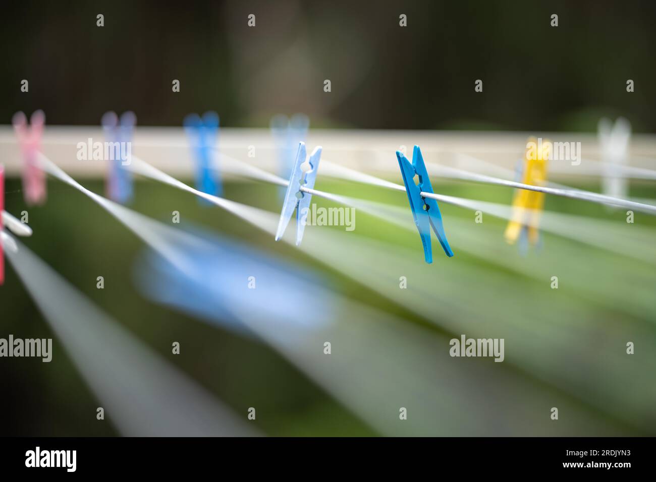 colored pegs on clothes line outside of a house in australia Stock ...