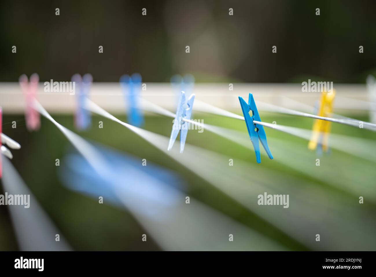 colored pegs on clothes line outside of a house in australia Stock ...
