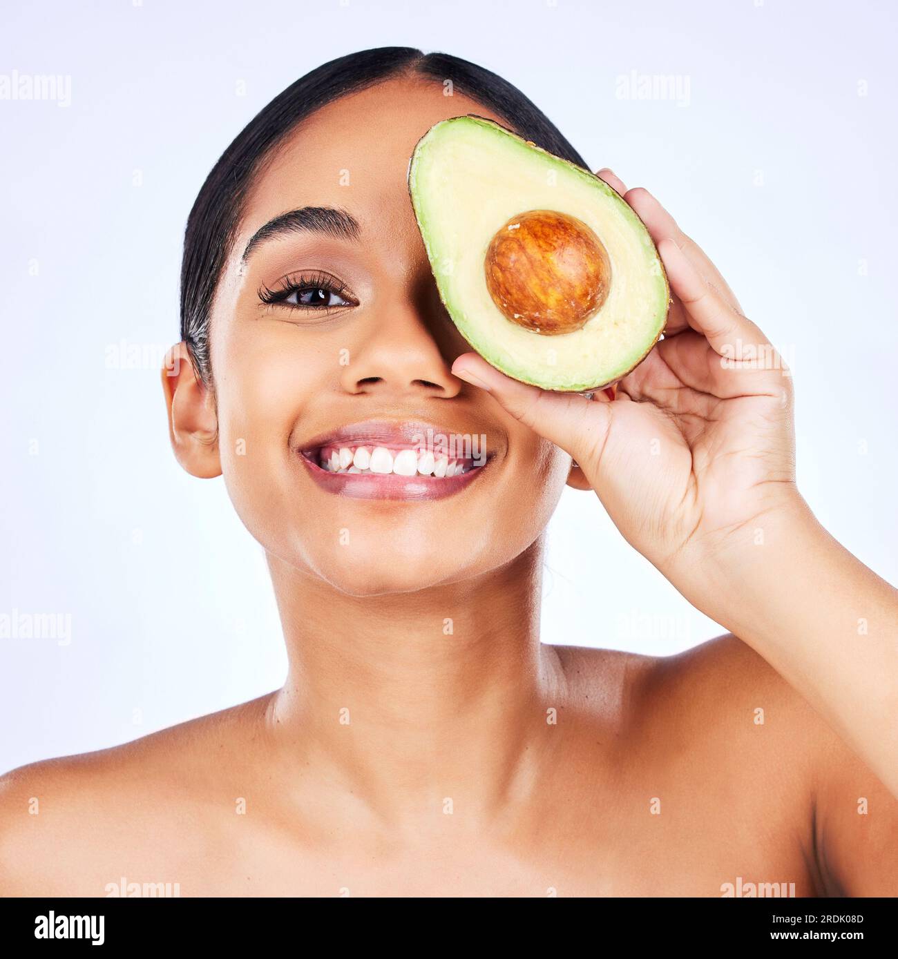 Skincare, avocado and portrait of Indian woman in studio happy with ...