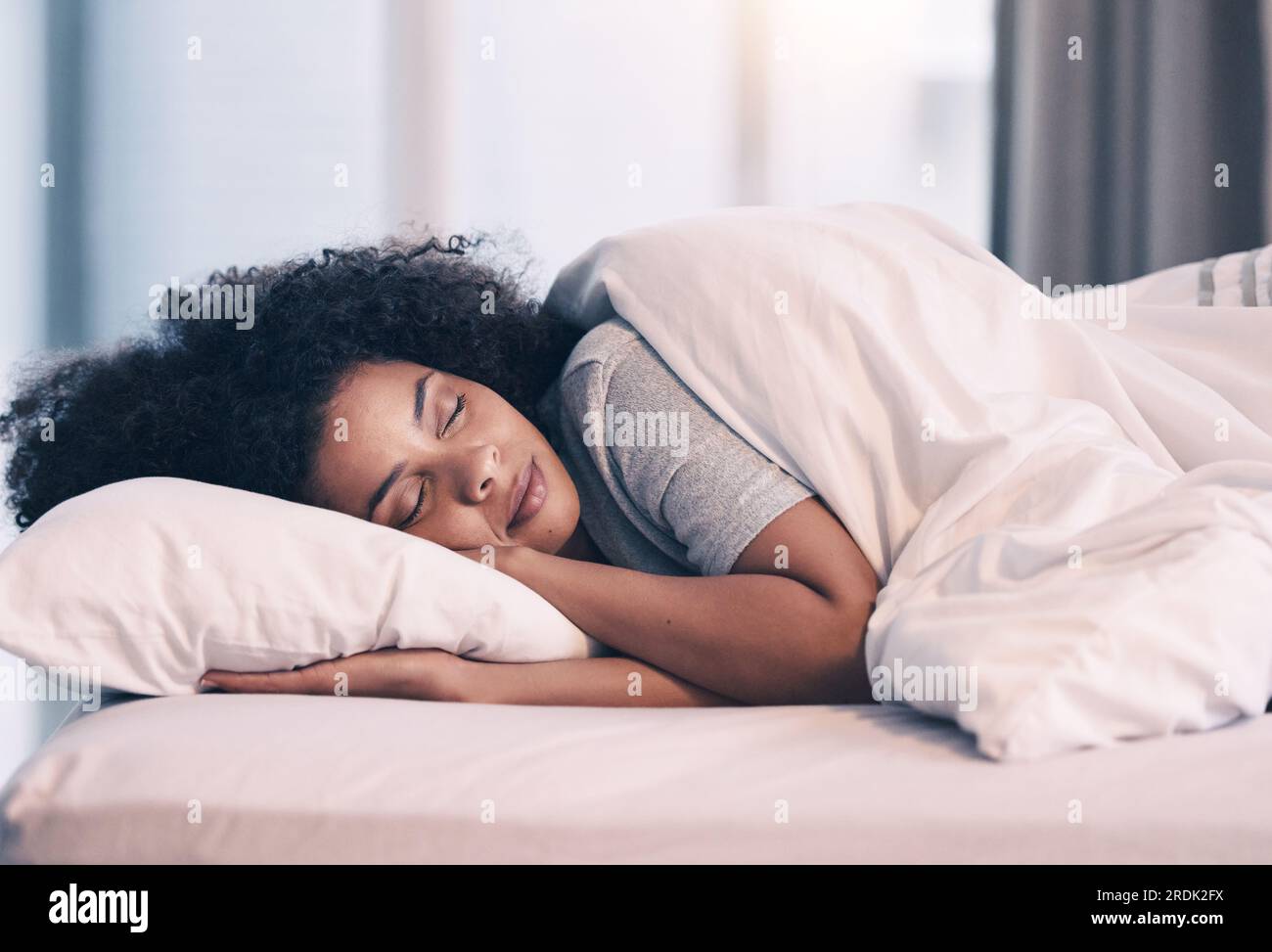 Sleeping, woman and bed with nap at home in morning with rest feeling ...