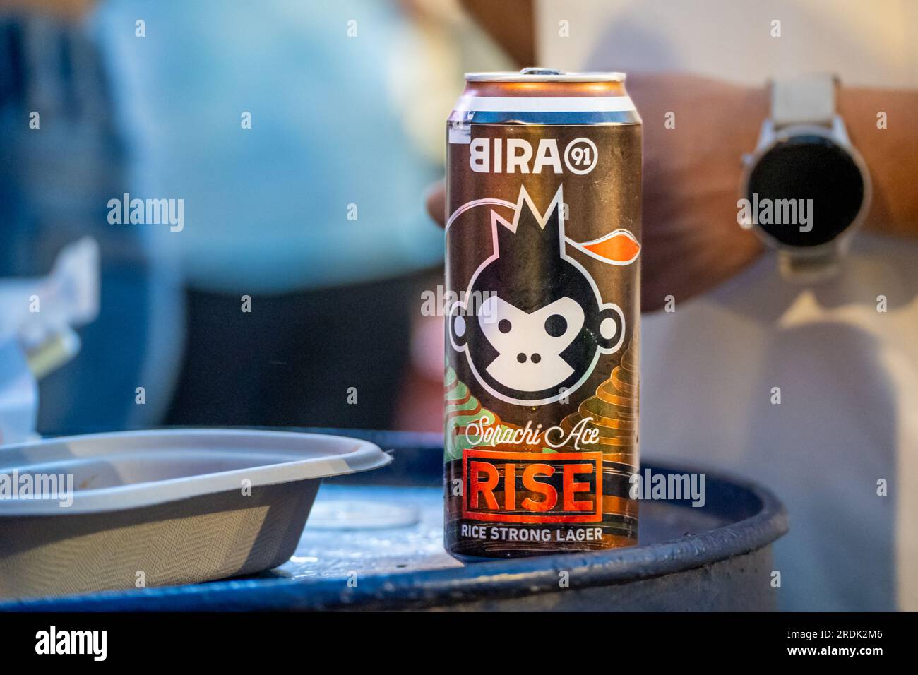 Can of Bira rise beer placed on top of a table in an outdoor venue ...