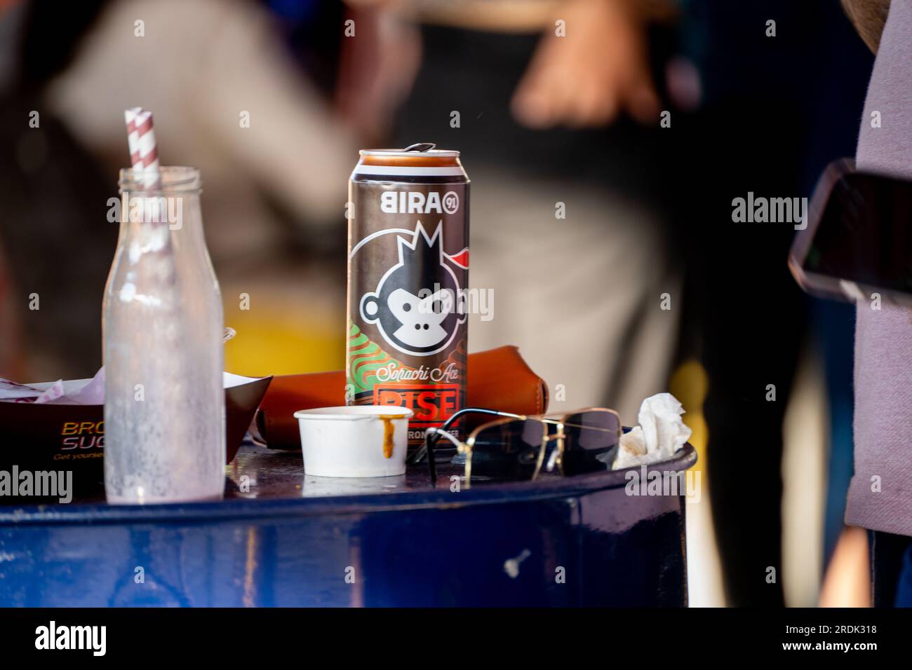 Can of Bira rise beer placed on top of a table in an outdoor venue ...