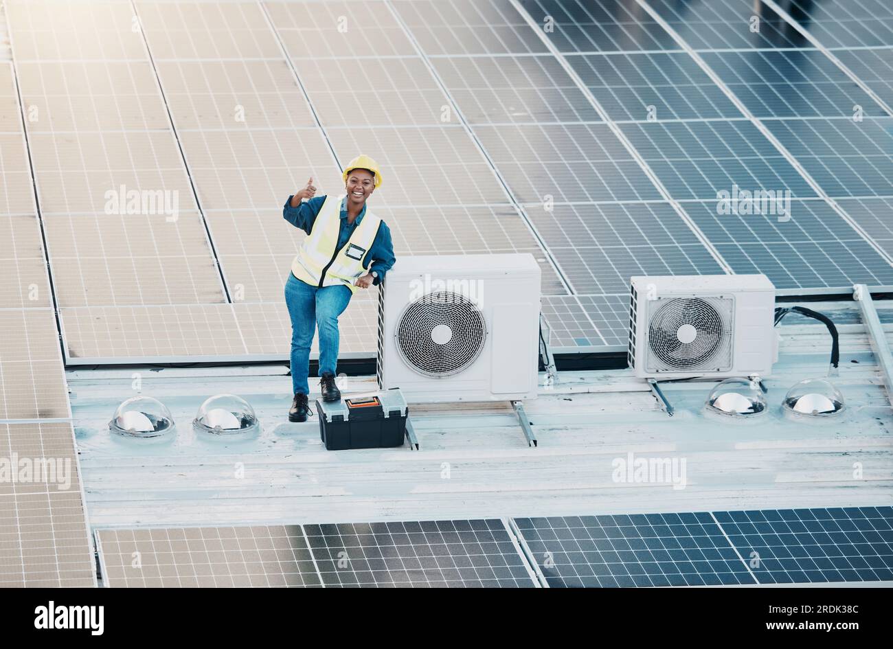 Engineer woman, solar panel and thumbs up with smile for clean power ...