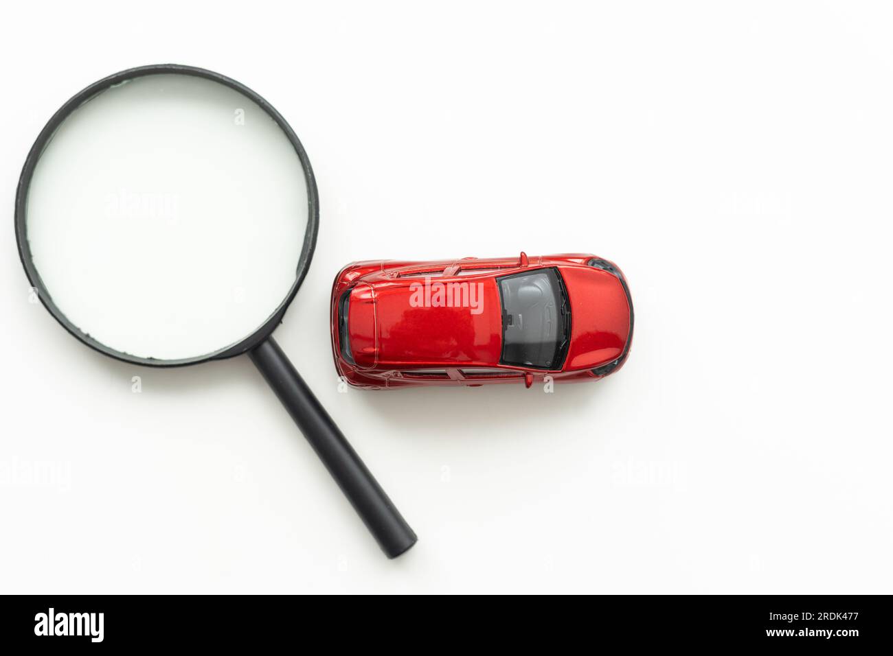 Magnifying glass and car Cut Out Stock Images & Pictures - Alamy