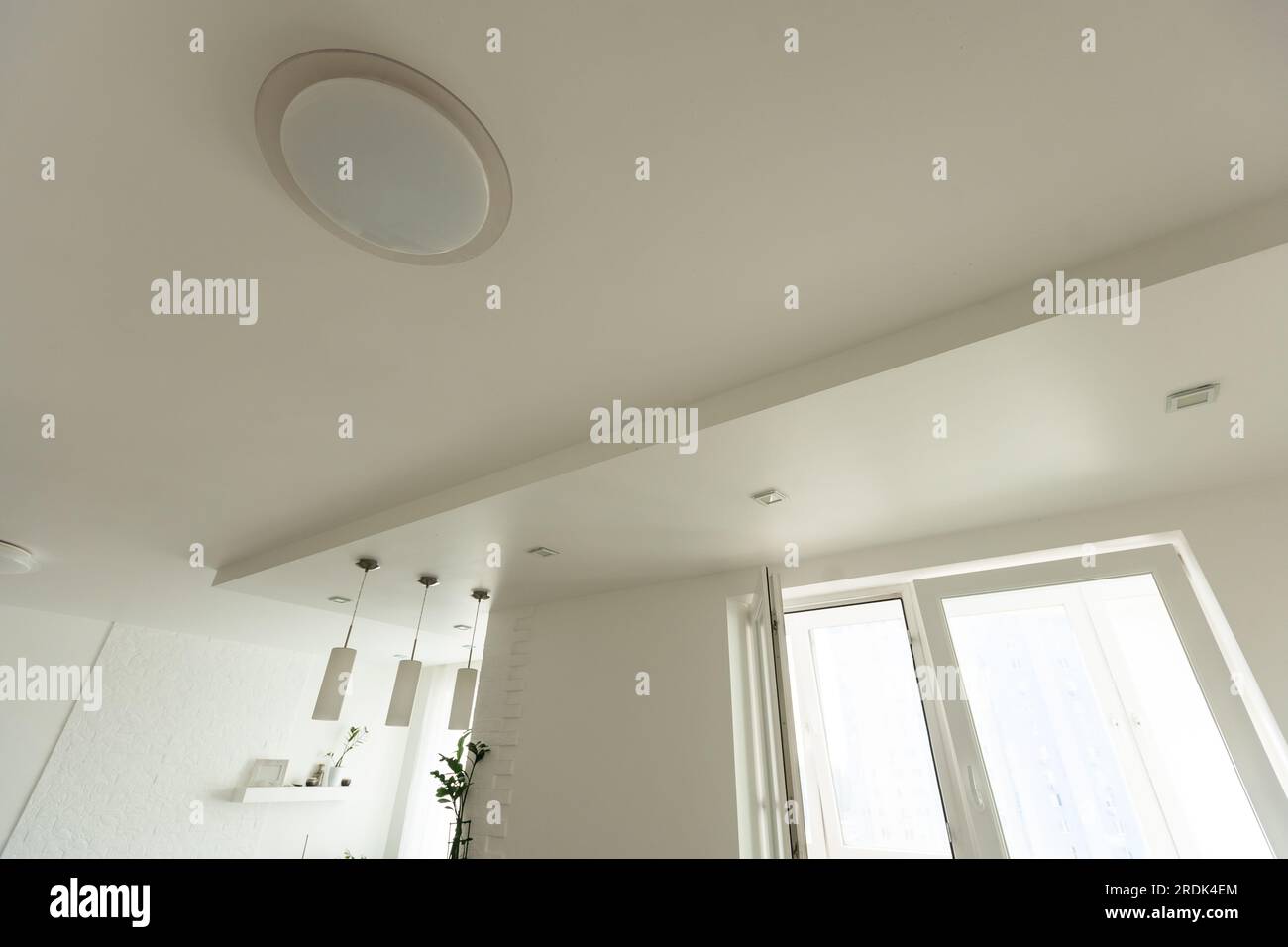 Clean gypsum board ceiling in construction site. Under construction a ...