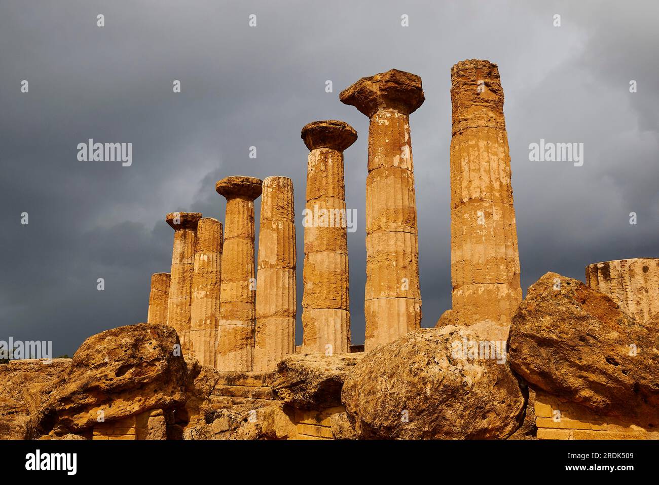 Row of columns, chapter, Heracles temple, dark clouds, sun ...