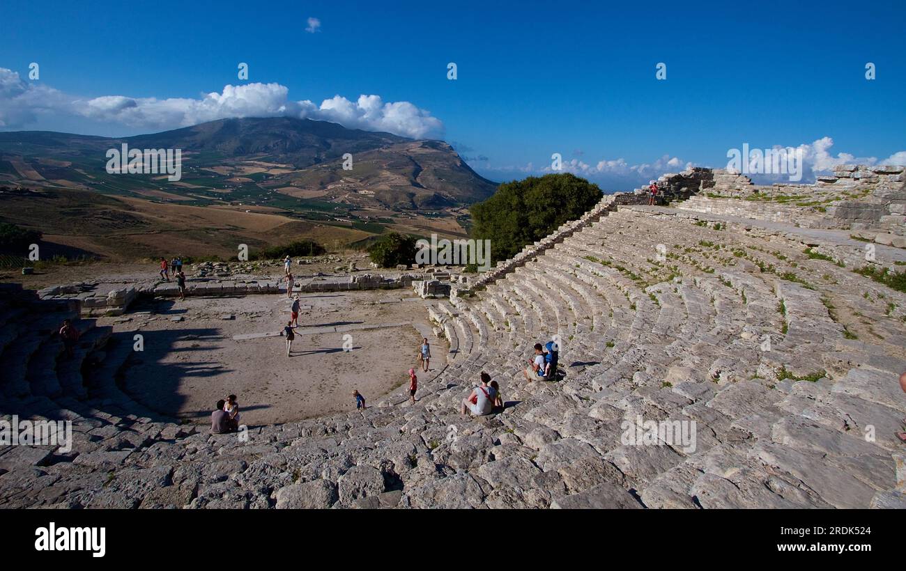 Evening light, Roman amphitheatre, few visitors in seats, Segesta ...