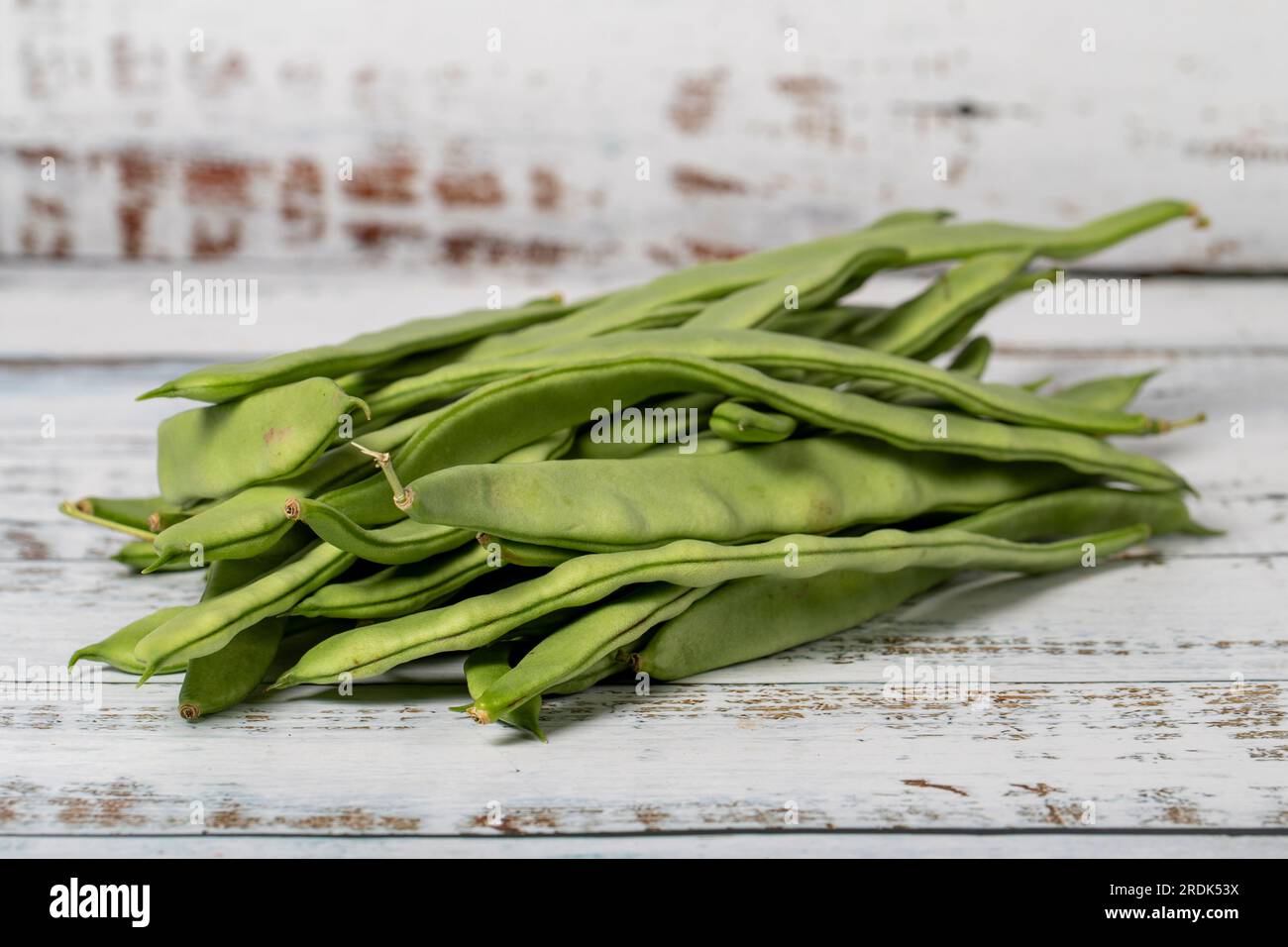 Green beans on a white wood background. Fresh raw string beans harvest ...