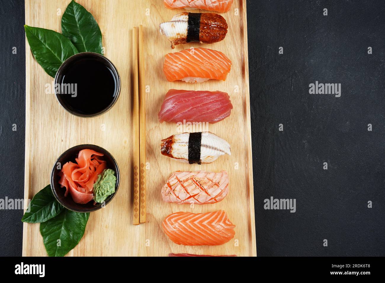 Japanese traditional Cuisine - Set of Nigiri sushi topped with sake ...