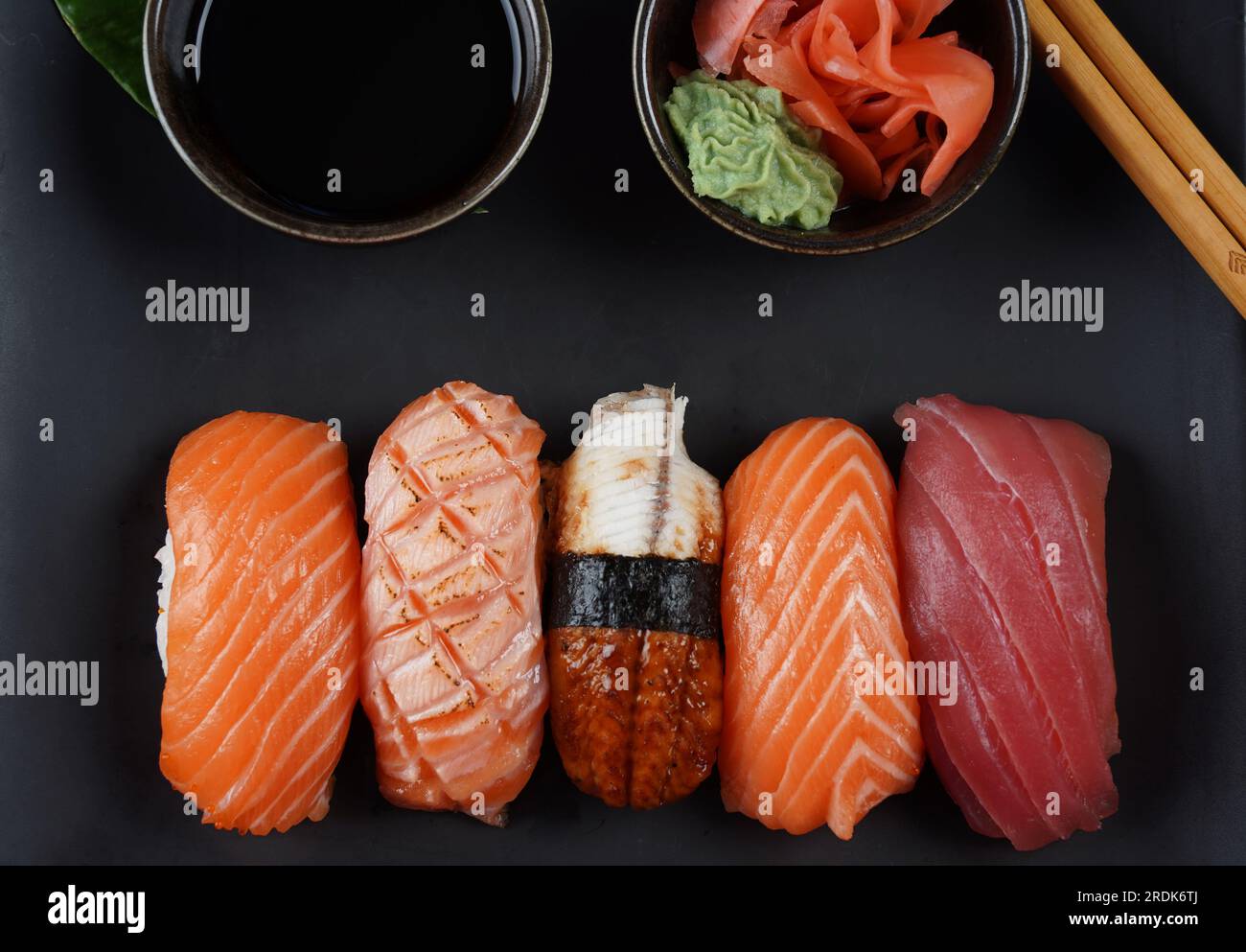 Japanese traditional Cuisine - Set of Nigiri sushi topped with sake ...