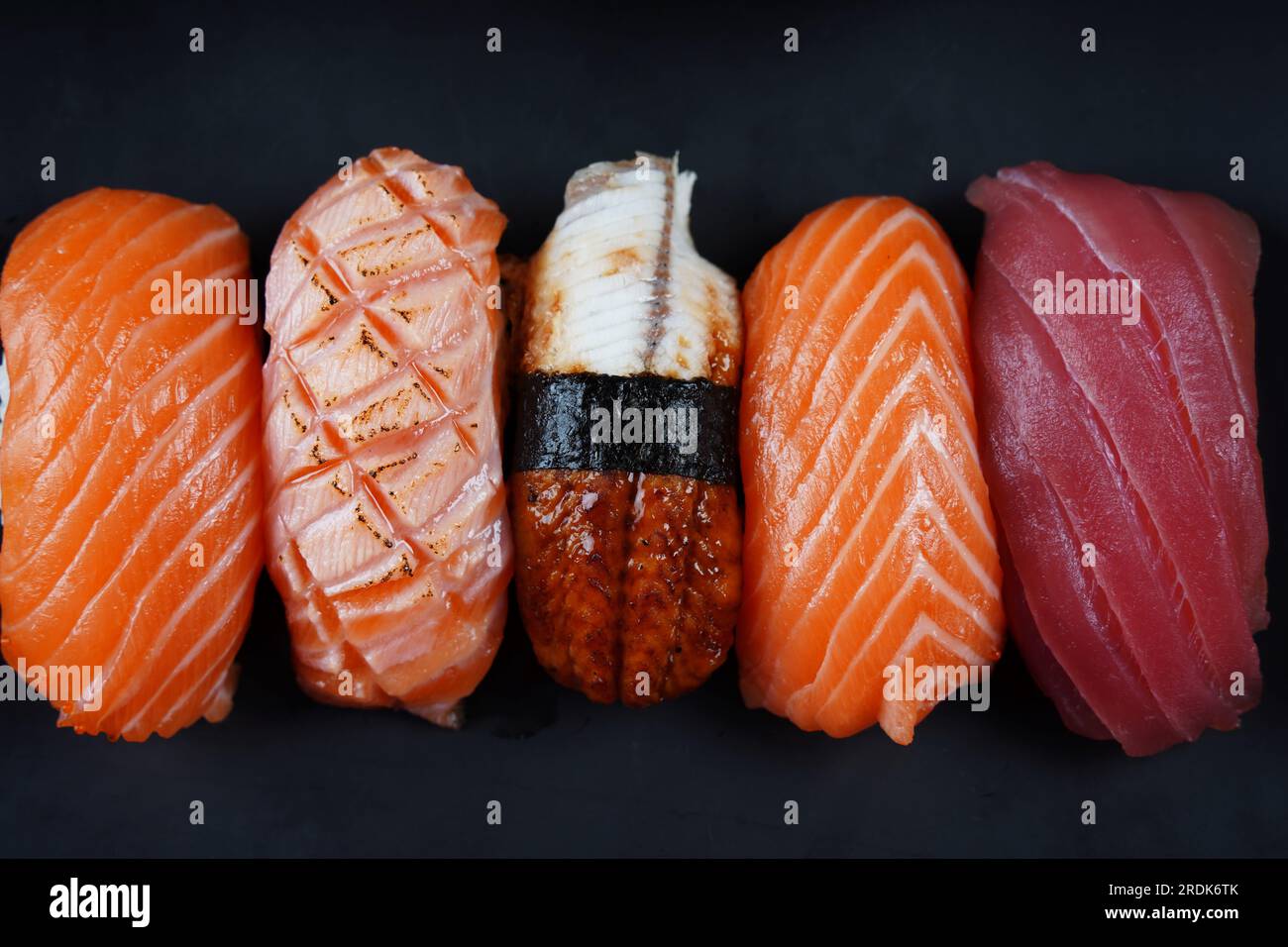Japanese traditional Cuisine - Set of Nigiri sushi topped with sake ...