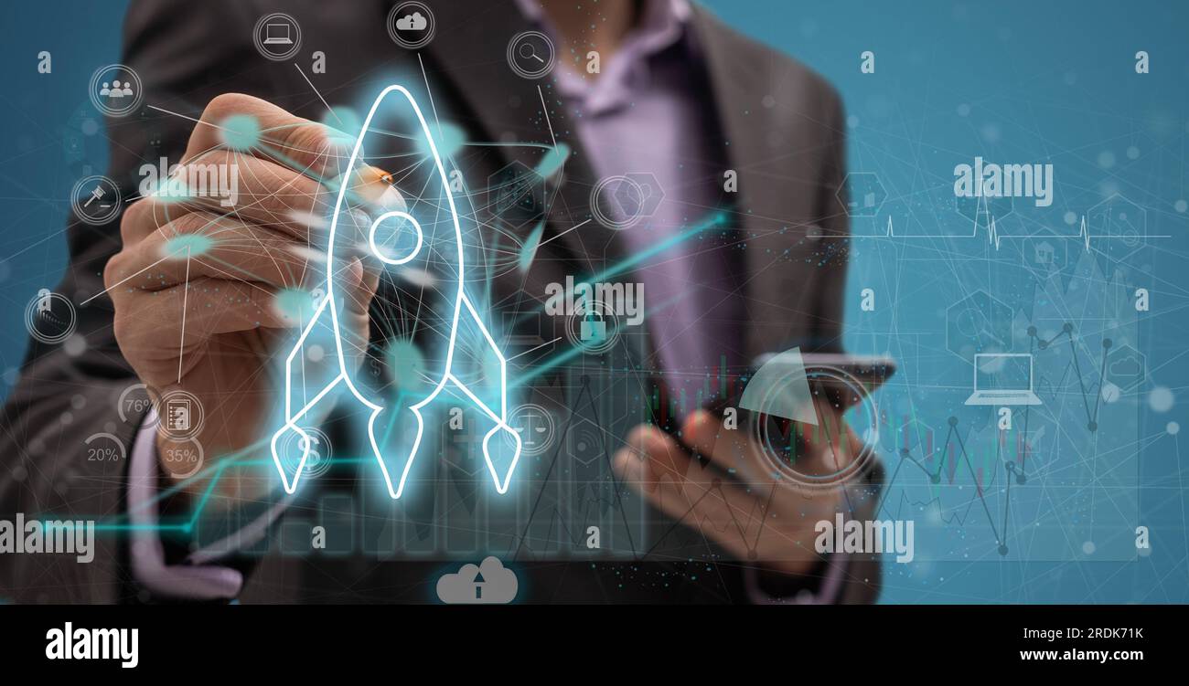 Startup concept with businessman holding tablet or smartphone ...