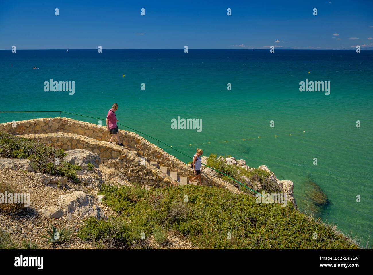 Coastal path overlooking the sea as it passes through Salou beaches, on ...