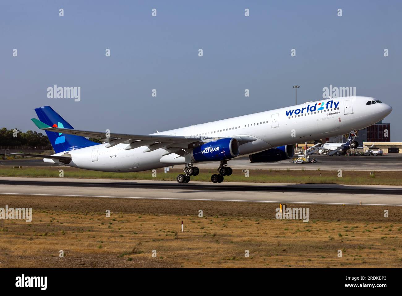 World 2 Fly Airbus A330-343 (Reg.: CS-TRH) departing Malta after having ...