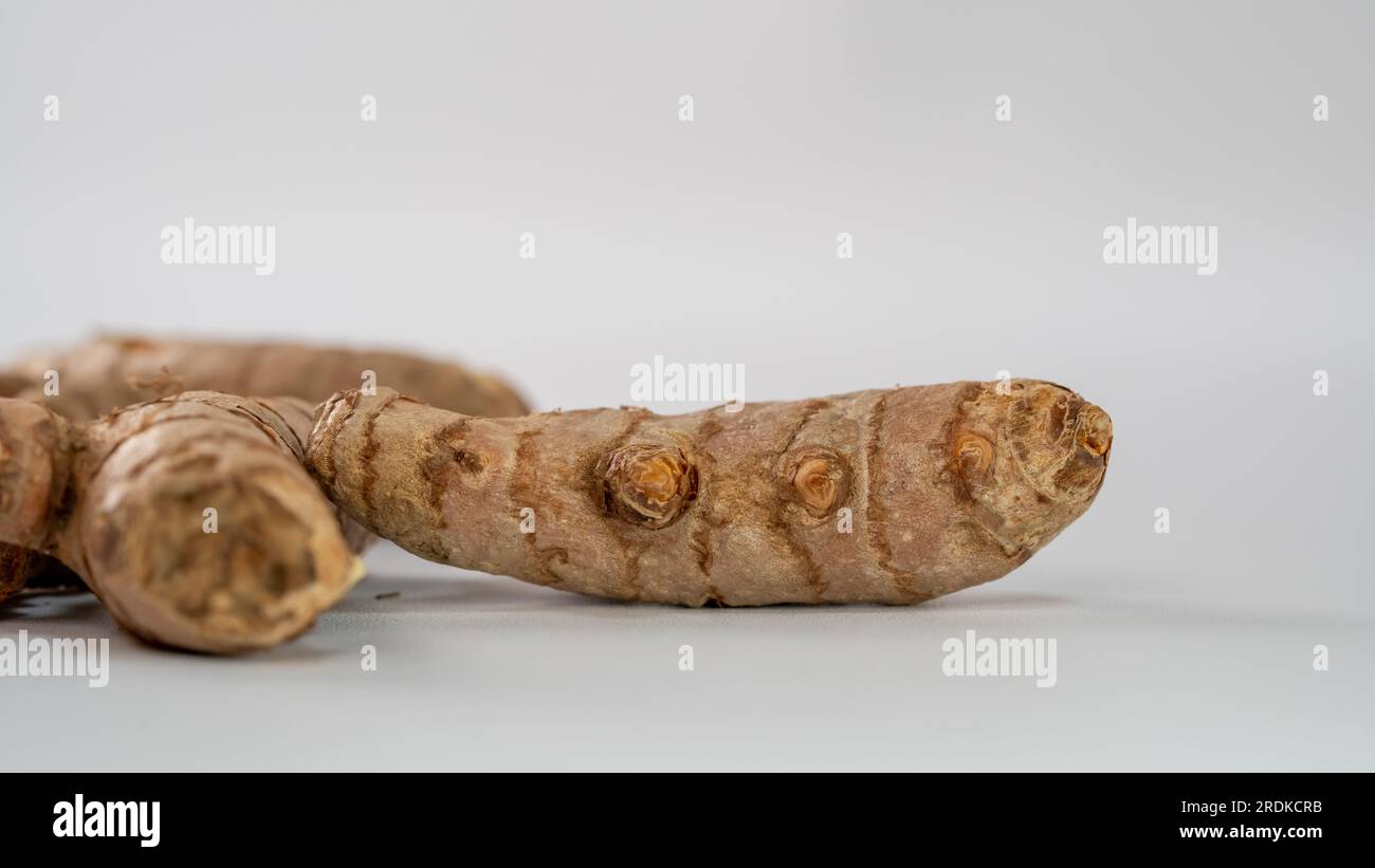 Turmeric (Curcuma longa Linn) rhizome (root) sliced isolated on white ...