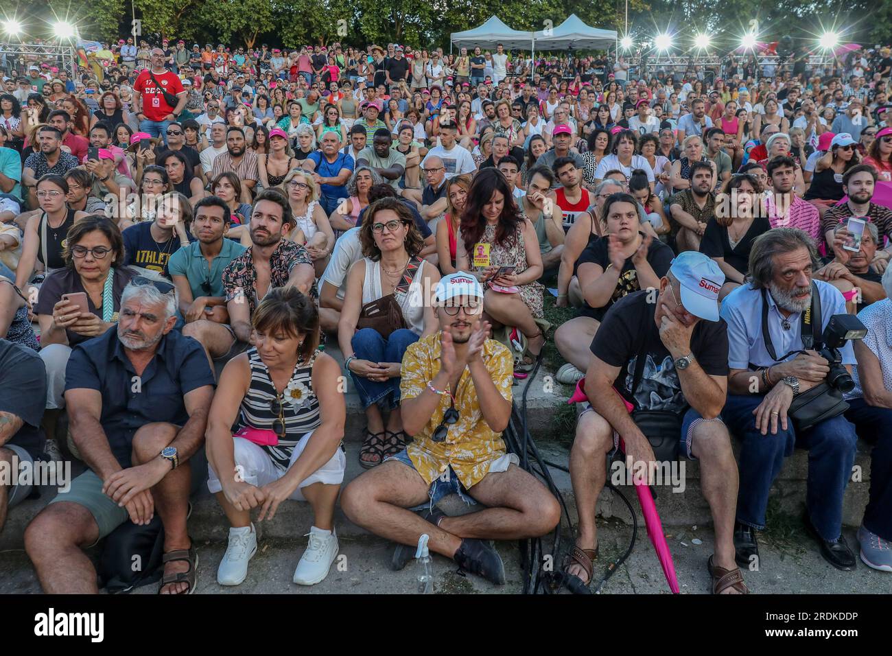 Madrid, Spain. 21st July, 2023. A group of supporters listen to the ...