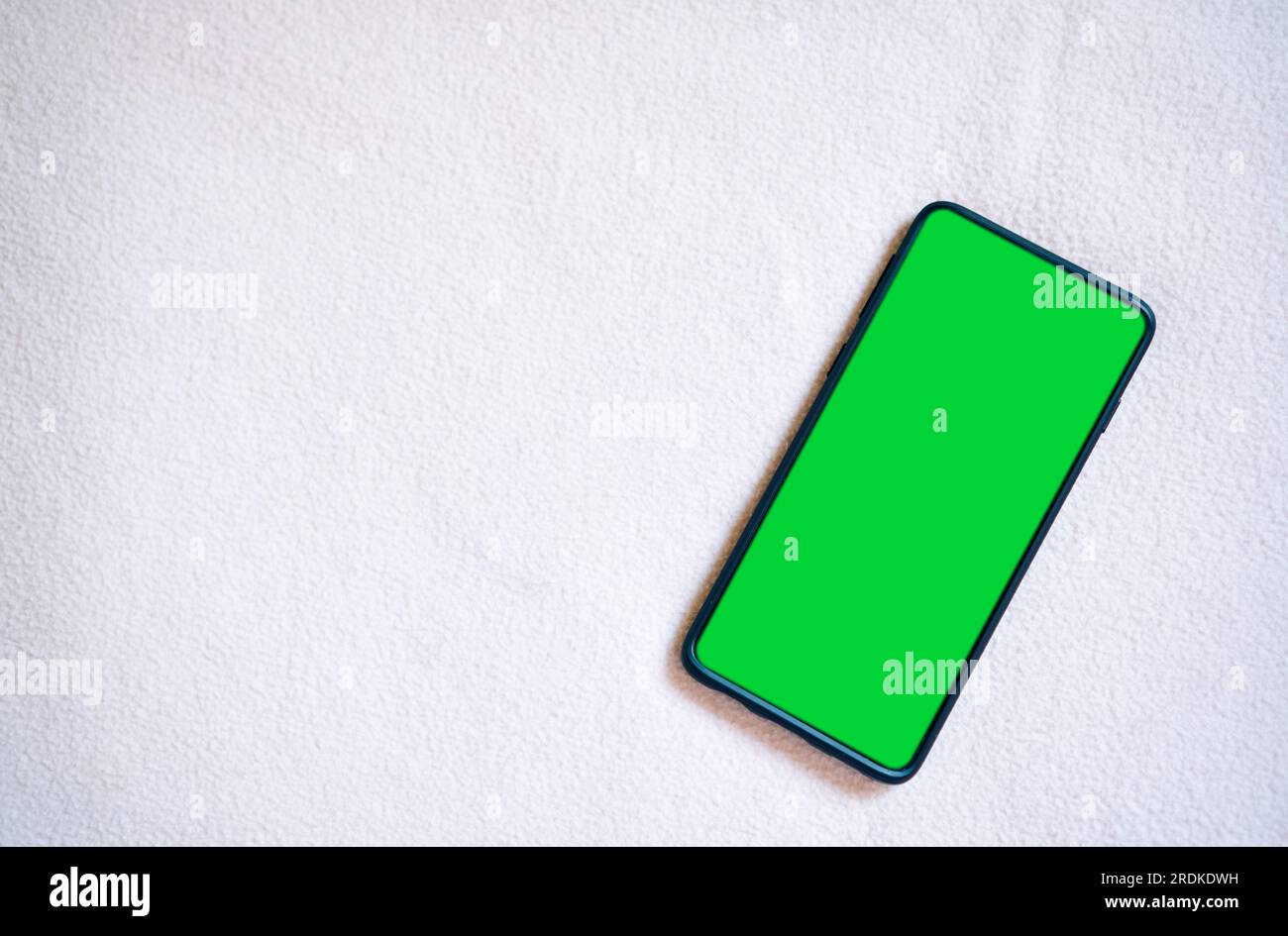 Flat lay photo of smartphone green screen. Chroma key phone screen in ...