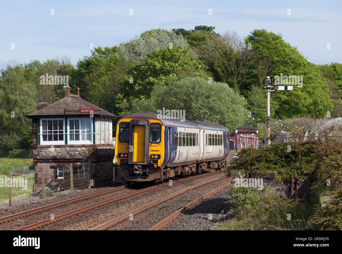 Northern rail class 156 sprinter train at Arnside with the signal box ...