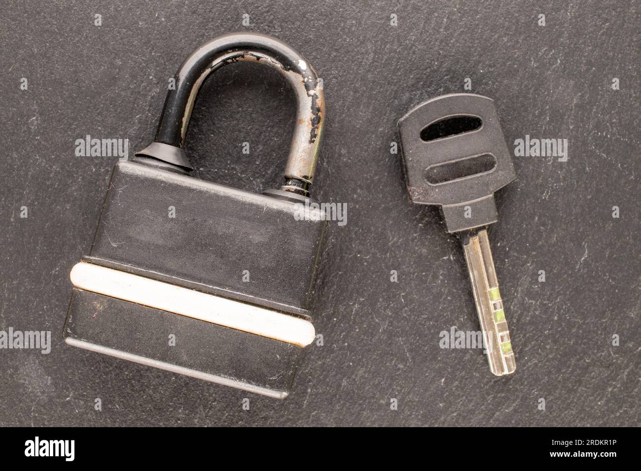 One door lock and key on slate stone, close-up, top view Stock Photo ...