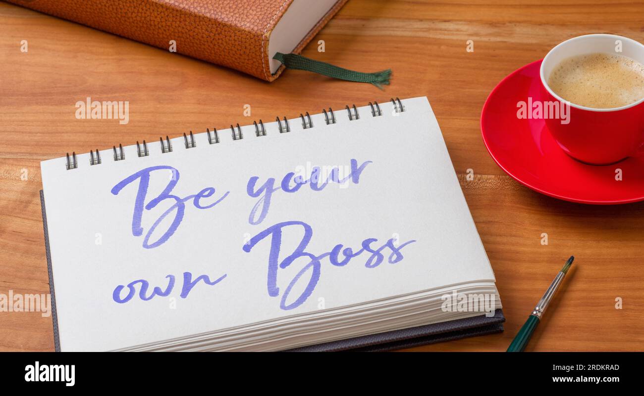 Notepad on a desk - Be your own Boss Stock Photo - Alamy