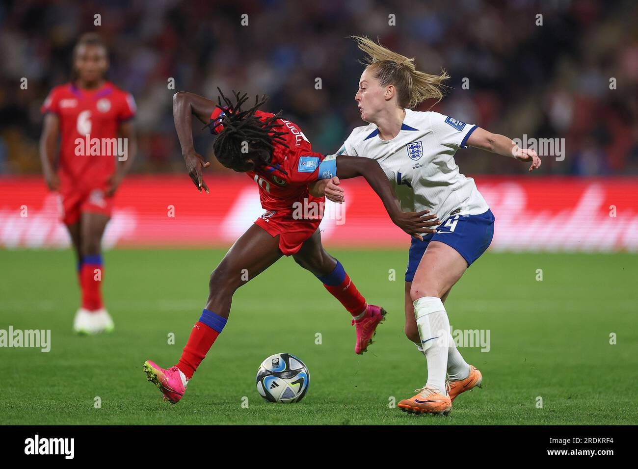 Nérilia Mondésir #10 of Haiti tackles the ball off Keira Walsh #4 of ...