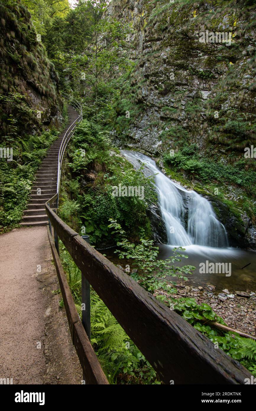 Waterfall with bridge at Allerheiligen waterfall cascade in a landscape ...