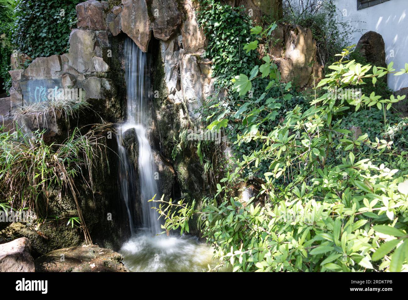 Torrential waterfall in the Chinese Garden of Heavenly Peace in ...