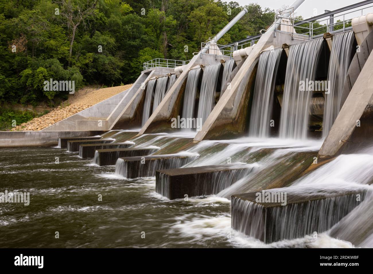 Water flowing over a dam that was constructed to form a lake Stock ...
