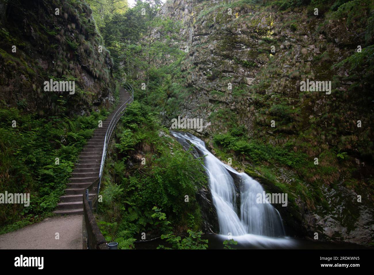 Waterfall with bridge at Allerheiligen waterfall cascade in a landscape ...