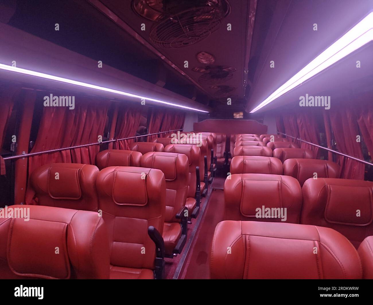 Deep red color interior of travel bus with lighting effect.Tourist bus ...