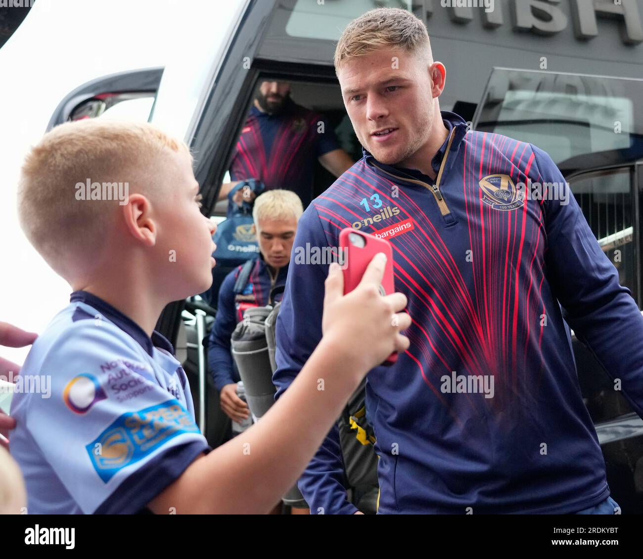 Morgan Knowles #13 of St. Helens is greeted by a young fan as he ...