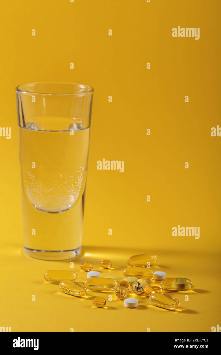 Assorted Oil filled yellow softgels capsules and pills Stock Photo - Alamy