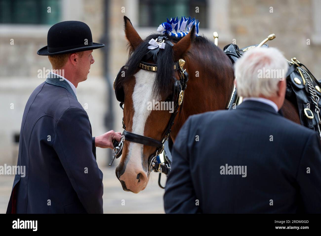 London, UK. 22 July 2023. A staff member tends a horse pulling a refuse ...