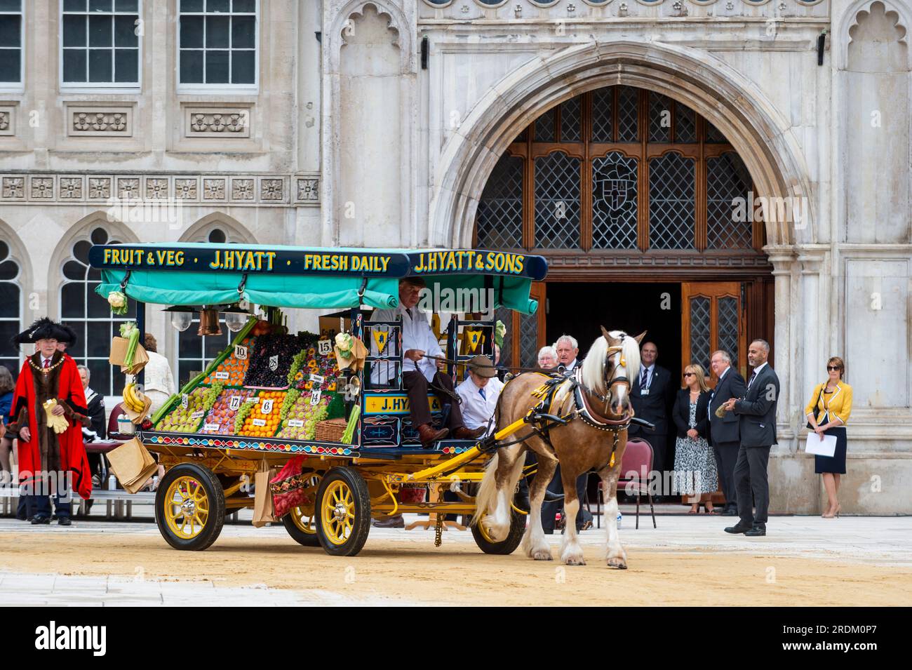 London, UK. 22 July 2023. A horse drawn fruit and vegetable carriage is ...